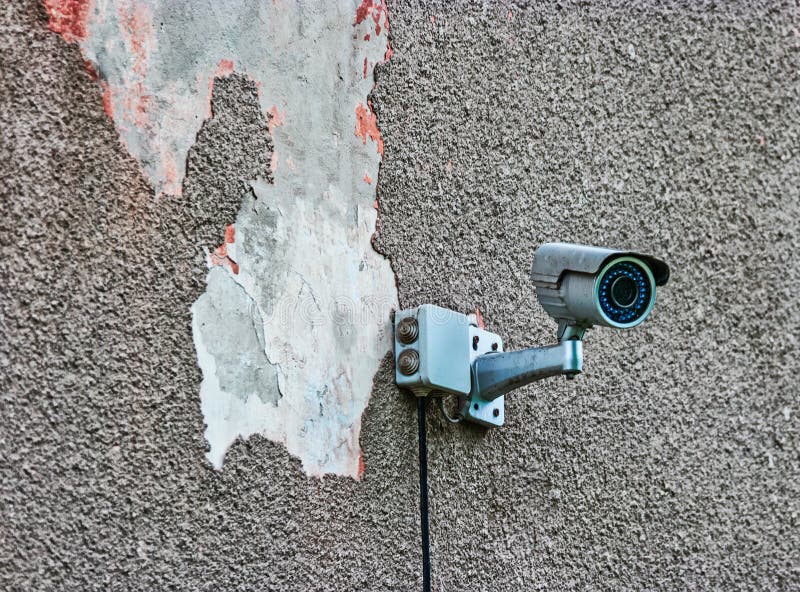 Security System Camera Mounted on Damaged Wall Stock Photo - Image of ...