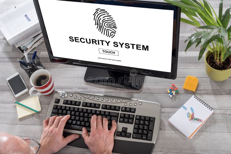 Security System Concept on a Computer Stock Photo - Image of hand, desk ...