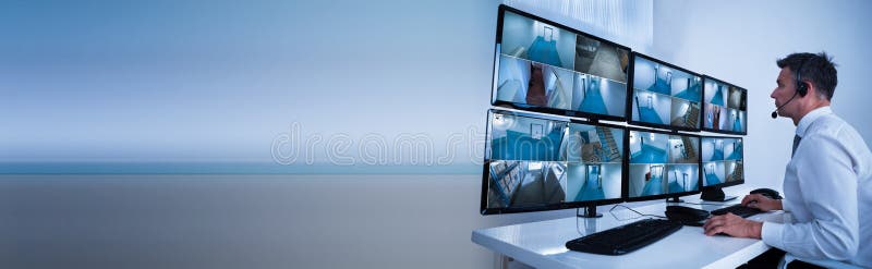 Security System Operator Looking at CCTV Camera Footage Stock Image ...