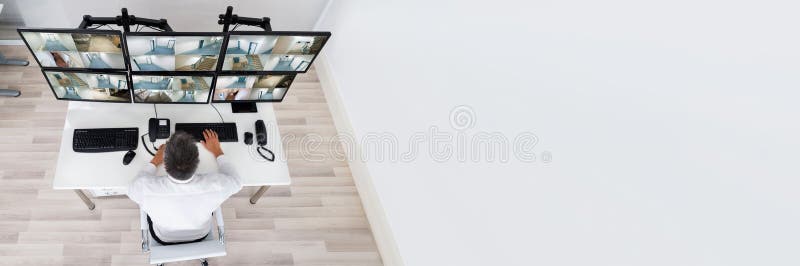 Security System Operator Looking at CCTV Camera Footage Stock Image ...