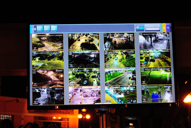 Security System Operator Looking at the CCTV Camera Images on the ...