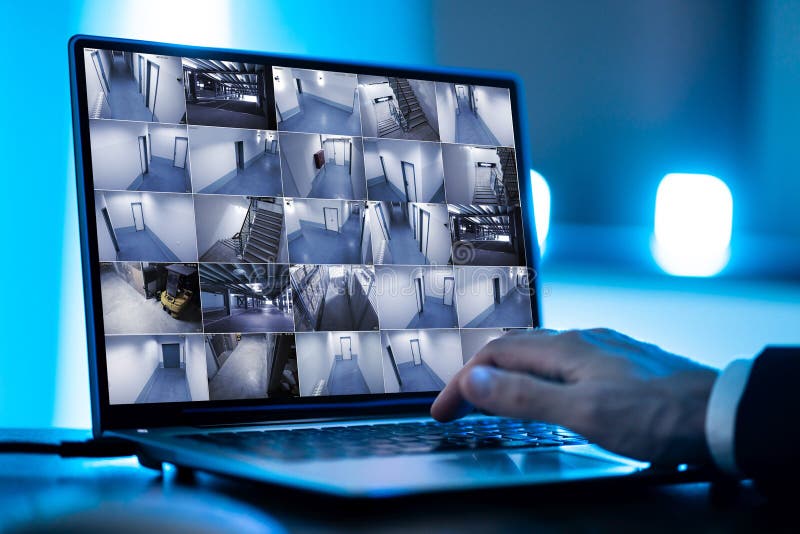 Security System Operator Looking at CCTV Footage at Desk Stock Image ...