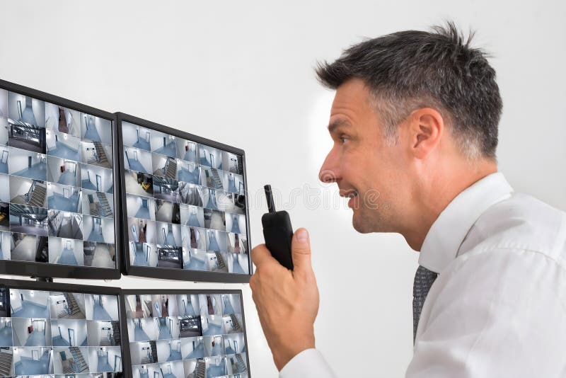 Security System Operator Looking at CCTV Footage Stock Image - Image of ...