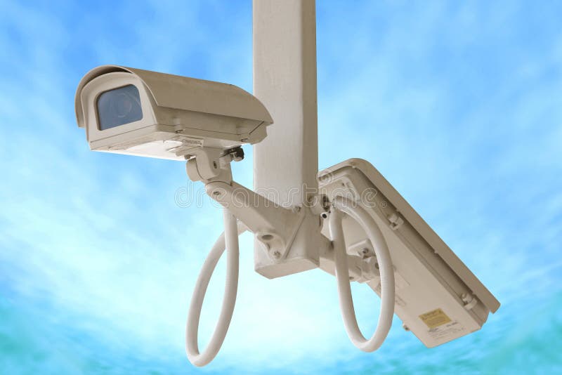 Security Twin Camera Isolated on Blue Sky Background. Stock Photo ...