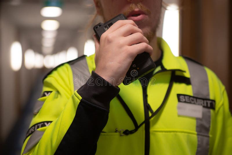 Security Worker Talking on a Walkie-talkie Stock Photo - Image of ...