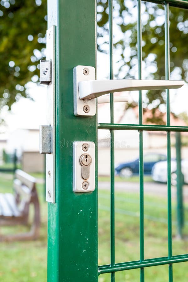 The Secutity Locks in an Iron Fences Stock Photo - Image of cylinders ...