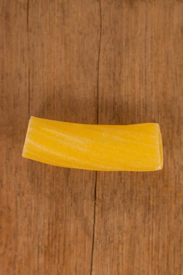 Sedani Rigati Pasta on Wooden Table Stock Image - Image of wood, fresh ...