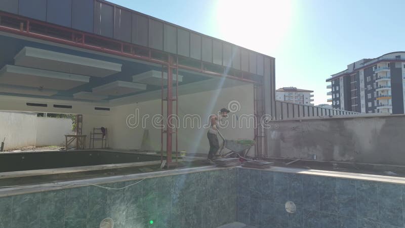 Complete Construction: 4K Aerial View of Pool and Facade Stock Video ...