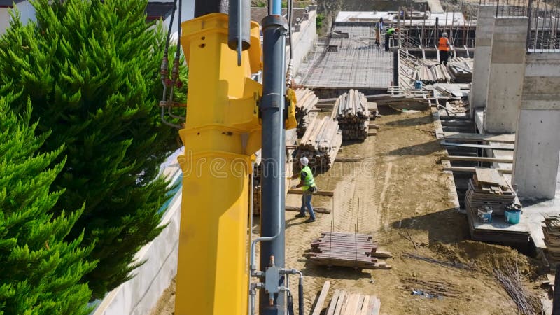 Aerial View 4K: Construction Workers Pouring Concrete on a Major ...