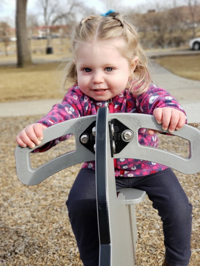 See saw fun stock image. Image of little, girl - 138237695