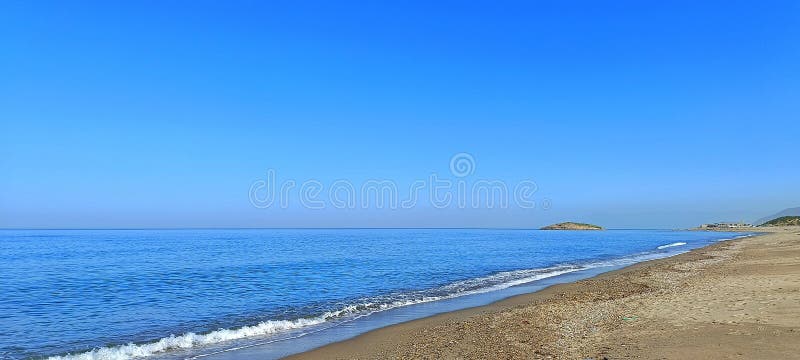 See Side with Waves and a Far Island Stock Image - Image of shore, cape ...