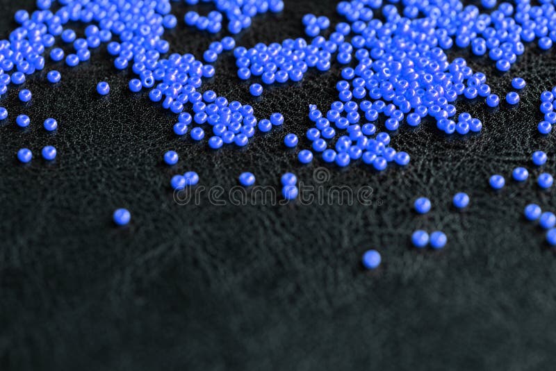 Seed Beads Blue Color Scattered on a Dark Background Close Up. Handmade ...