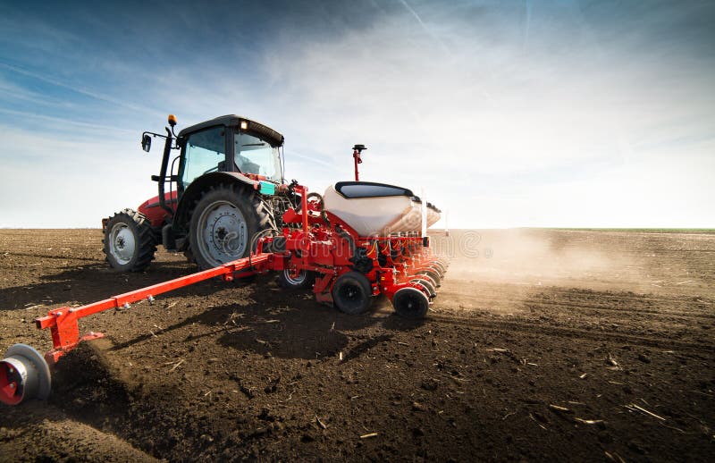 Seeding crops at field stock photo. Image of drawbar - 70727210