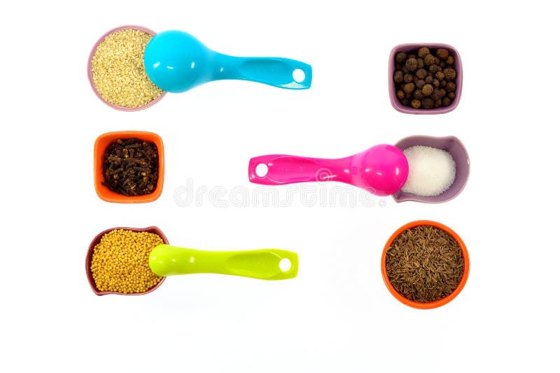Seeds, Spices, Grains in Small Multi-colored Cups and Measuring Spoons ...