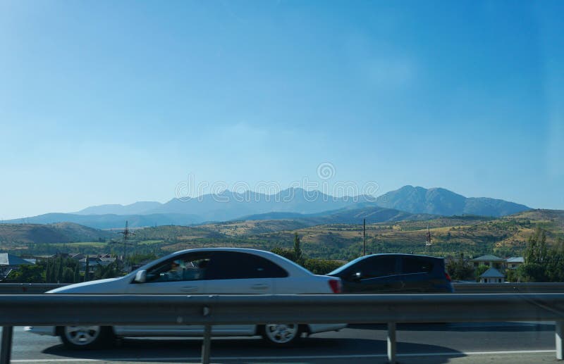 Seeing Cars Pass by the Side of the Road Stock Image - Image of cloud ...