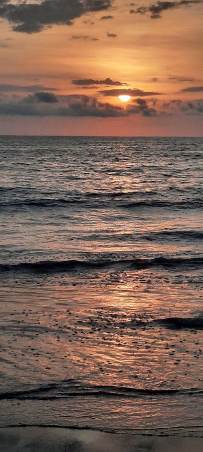 Seeing the Sunset on the Beach Stock Photo - Image of night, overcast ...
