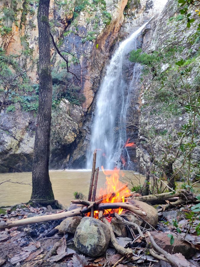 Campfire Facing a Waterfall Stock Photo - Image of people, park: 270763914