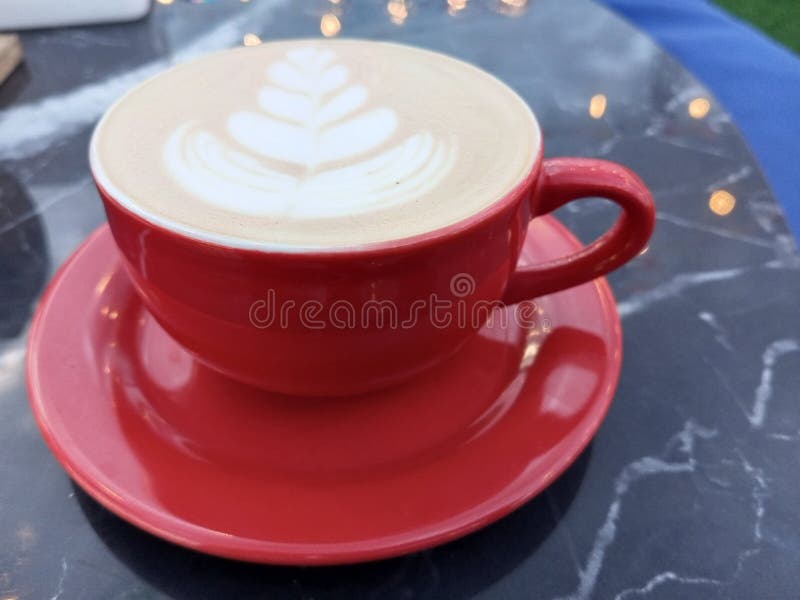 Seen a Cup of Cappuccino Coffee Served in a Red Cup on a Marble Table ...
