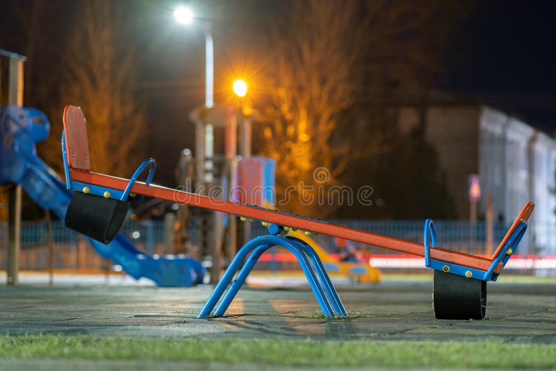 Seesaw Swing in Preschool Yard with Soft Rubber Flooring at Night Stock ...
