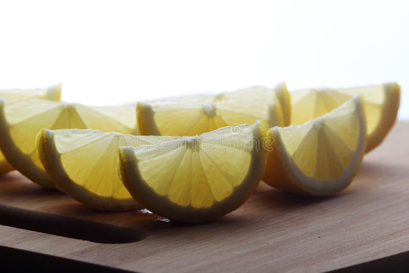 Segments of Lemon in Counter Light Stock Photo - Image of segments ...