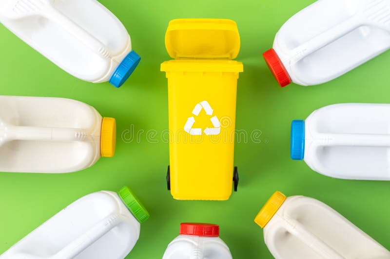 Segregation of Plastic Waste, Green Garbage Bin and Plastic Bottles on ...