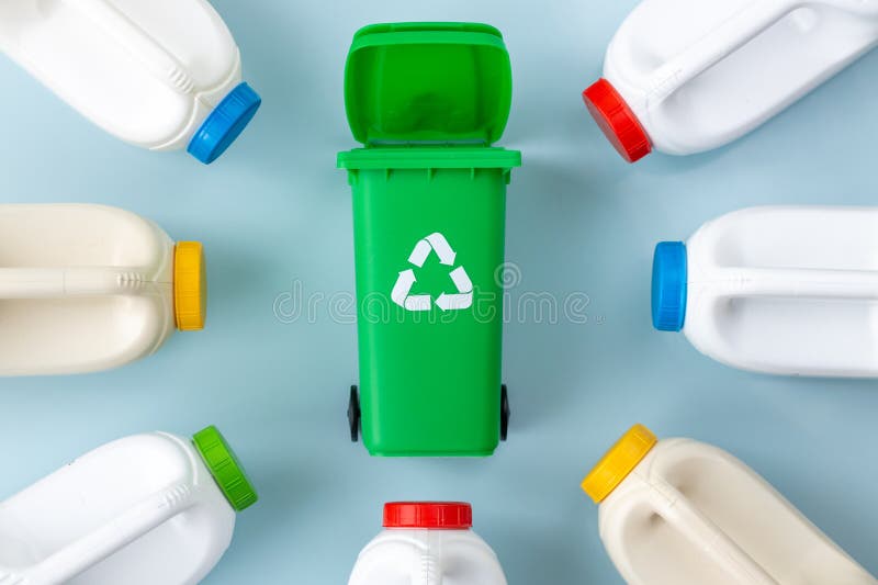 Segregation of Plastic Waste, Green Garbage Bin and Plastic Bottles on ...