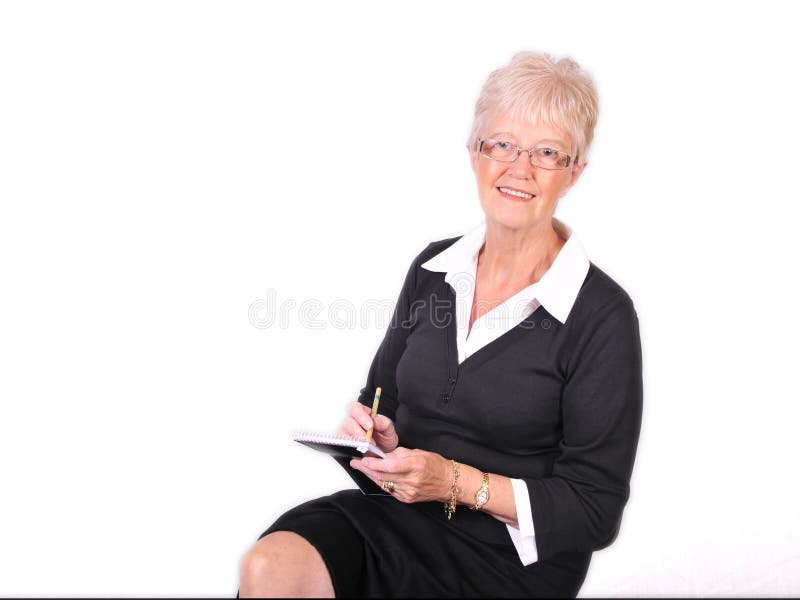 Segretaria Matura Che Cattura Le Note Fotografia Stock - Immagine di ...