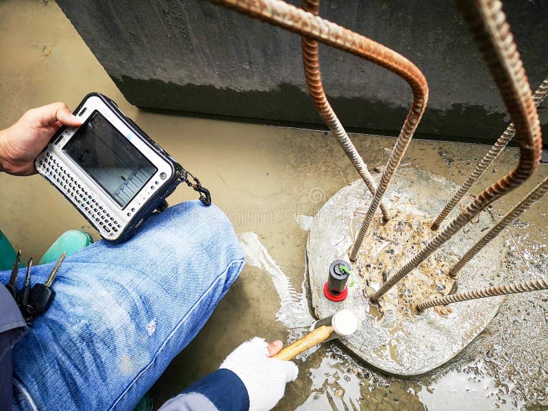 Engineering Seismic Test On A Concrete Pile In Construction Site Stock ...