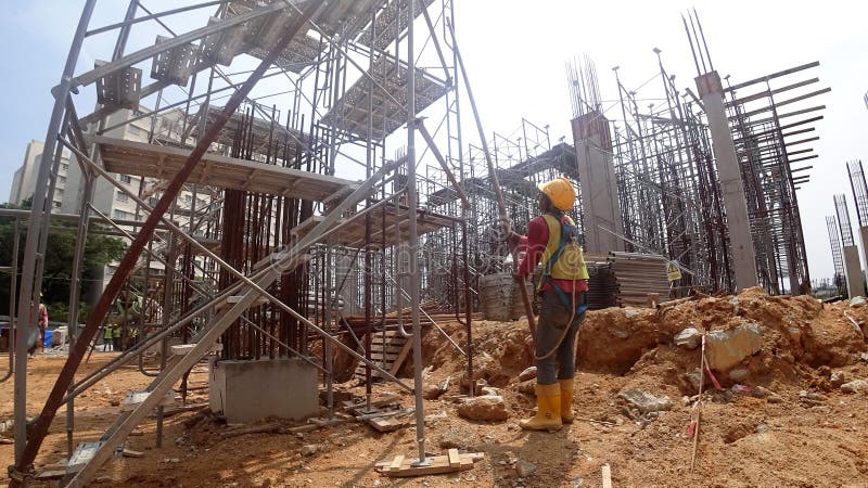 A Group of Construction Workers is Working at a Construction Site ...