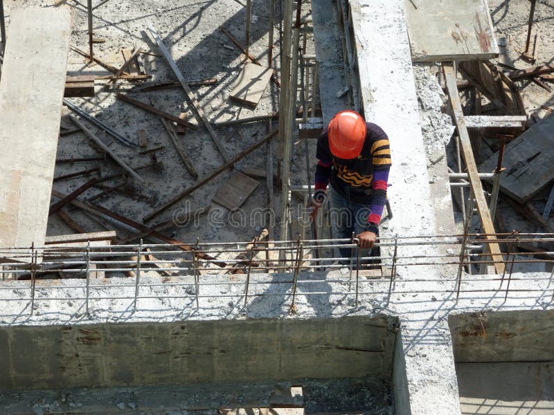 A Group of Construction Workers is Working at a Construction Site ...
