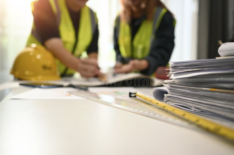 Select Focus on Blueprints and Technical Tools on White Table with ...