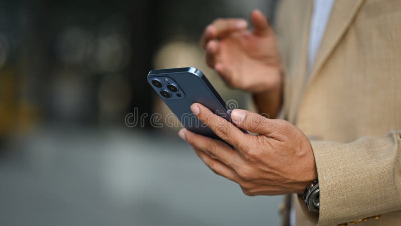 Select Focus on Hand of Businessman Using Smartphone while Standing ...