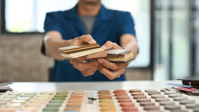 Select Focus Hands of Interior Designer Holding Material Samples ...