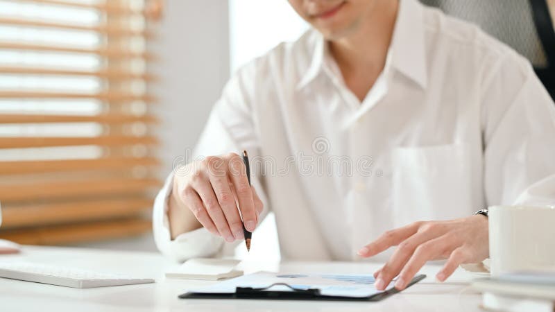 Selected Focus on Hand. Businessman Holding Pen in Hand Working ...