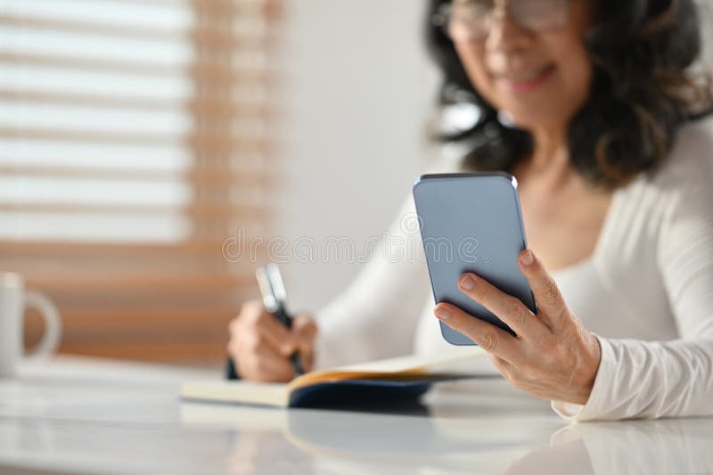 Selected Focus on Hand. Smiling Senior Woman Checking Working Schedule ...