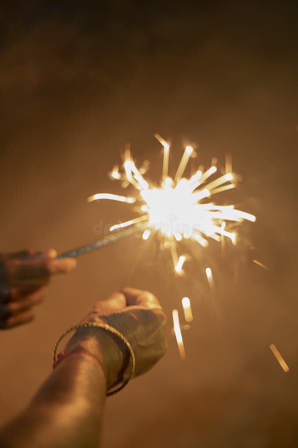 Selected Focus Shot of an Indian Woman Holding a Firecracker Stock ...