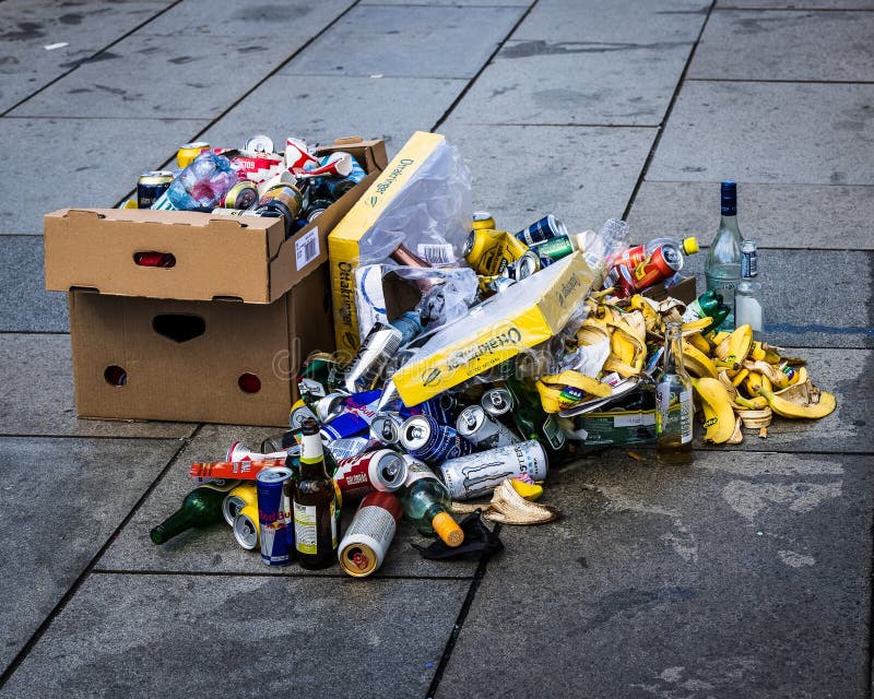 Selection of Beer Bottles and Boxes on a Concrete Sidewalk after an ...