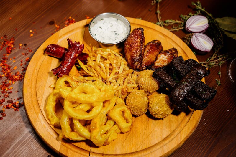 Selection of Beer and Snacks.Chips, Fish, Beer Sausages on the Table ...