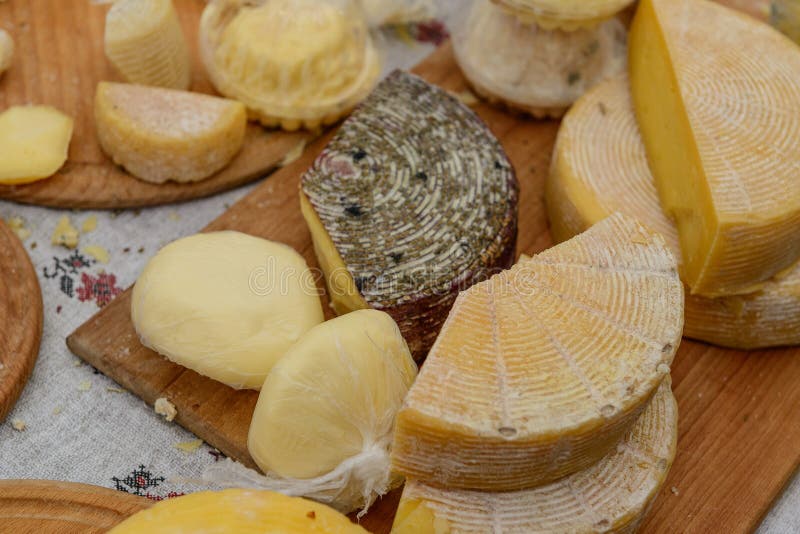 Selection of Cheese on the Table Stock Image - Image of hand, delicious ...