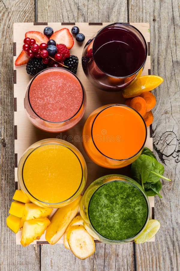Selection of Colourful Smoothies on Rustic Wood Background Stock Image ...