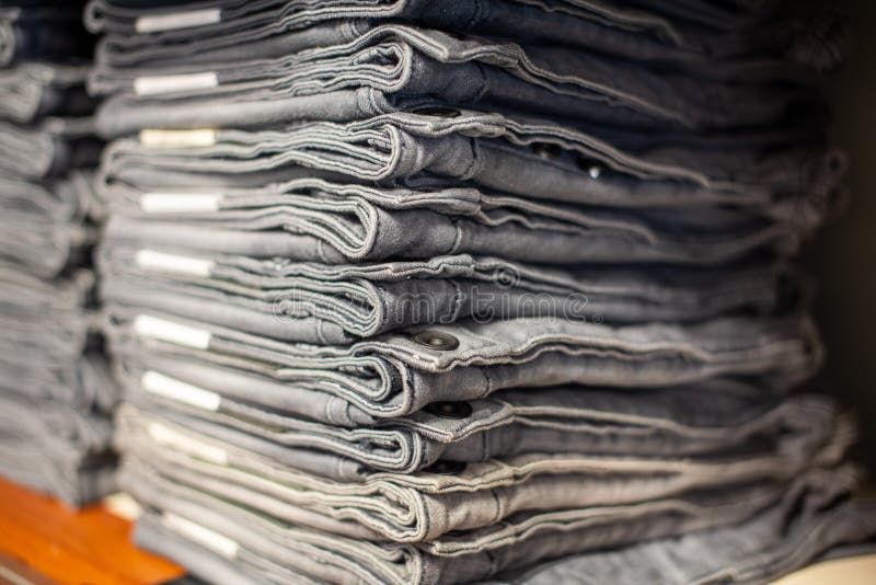 Selection of Jeans Stacked on Top of Each Other Stock Image - Image of ...