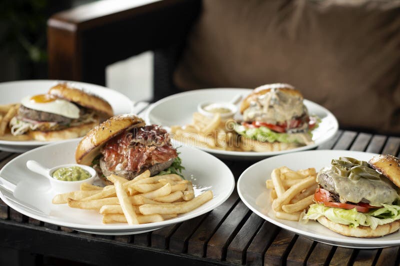 Selection of Many Different Burgers on Restaurant Table Stock Photo ...