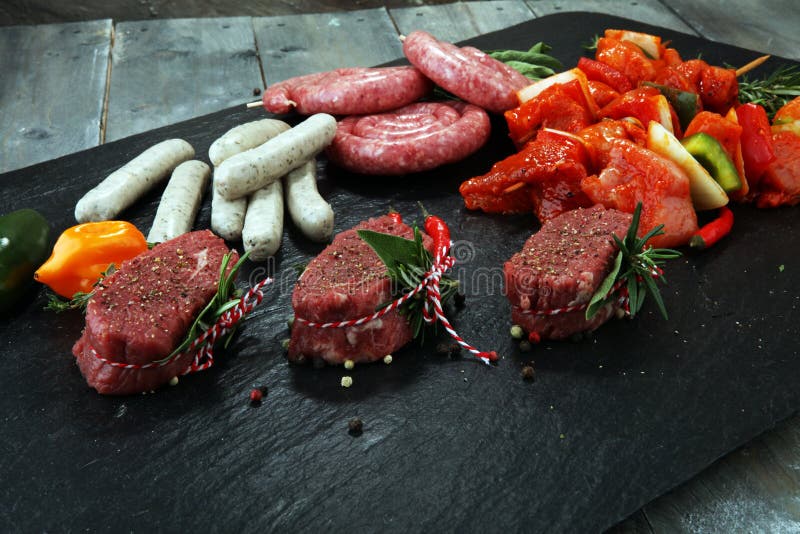 Selection of Marinaded Meat for Bbq Grilling with Herbs on Table Stock ...