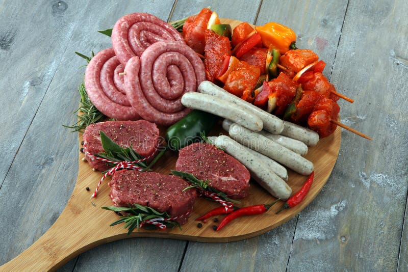 Selection of Marinaded Meat for Bbq Grilling with Herbs on Table Stock ...