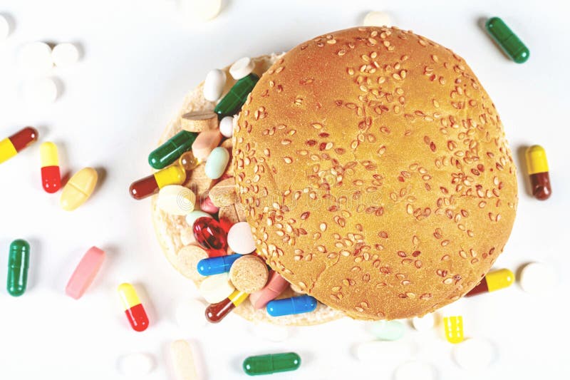 Of a Selection of Multivitamin Tablets in a Hamburger Stock Photo ...