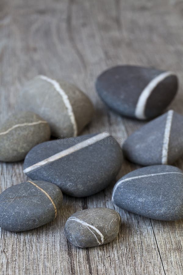 Selection of Pebble with a Single White Stripe Stock Image - Image of ...