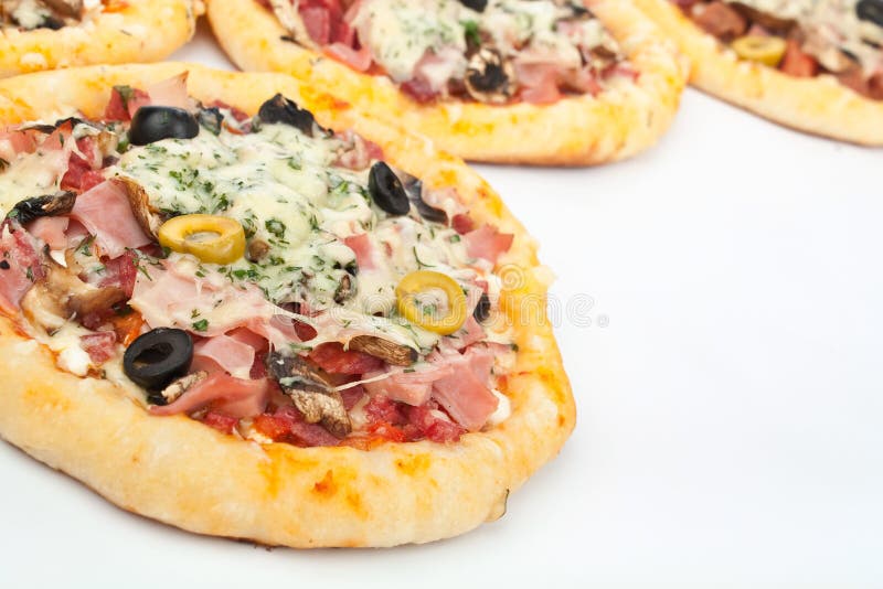Small pizzas in a row stock image. Image of junkfood - 42619607