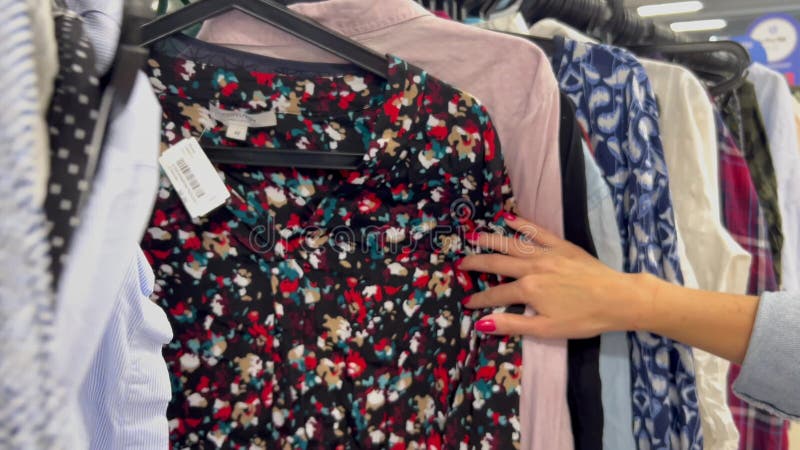 Selection of Second-hand Clothes. Close-up of a Woman S Hand Choosing ...