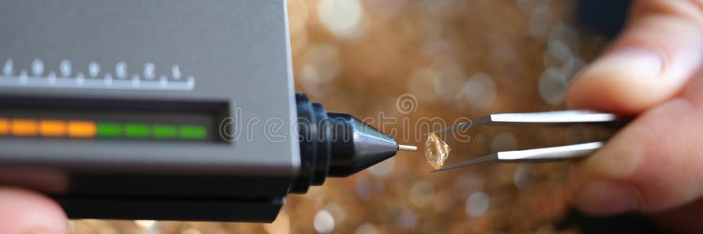 Many Diamonds, Tweezers and Diamond Testing Machine Close Up. Stock ...