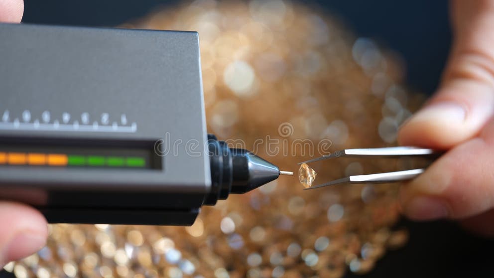 Many Diamonds, Tweezers and Diamond Testing Machine Close Up. Stock ...